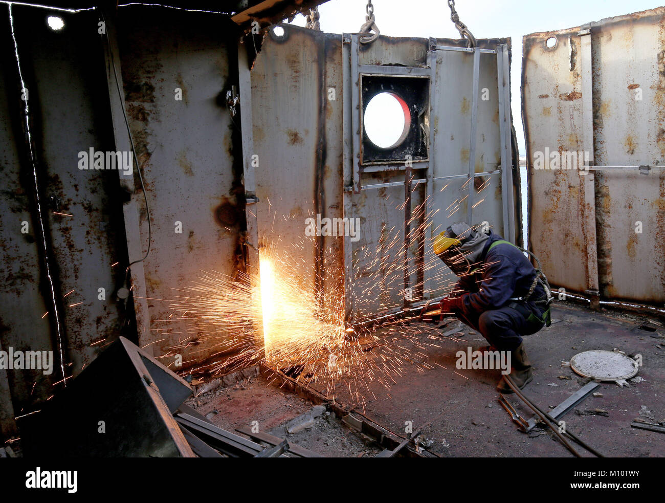 A Romanian plate-worker at Dales Marine Limited breaks up part of a ...