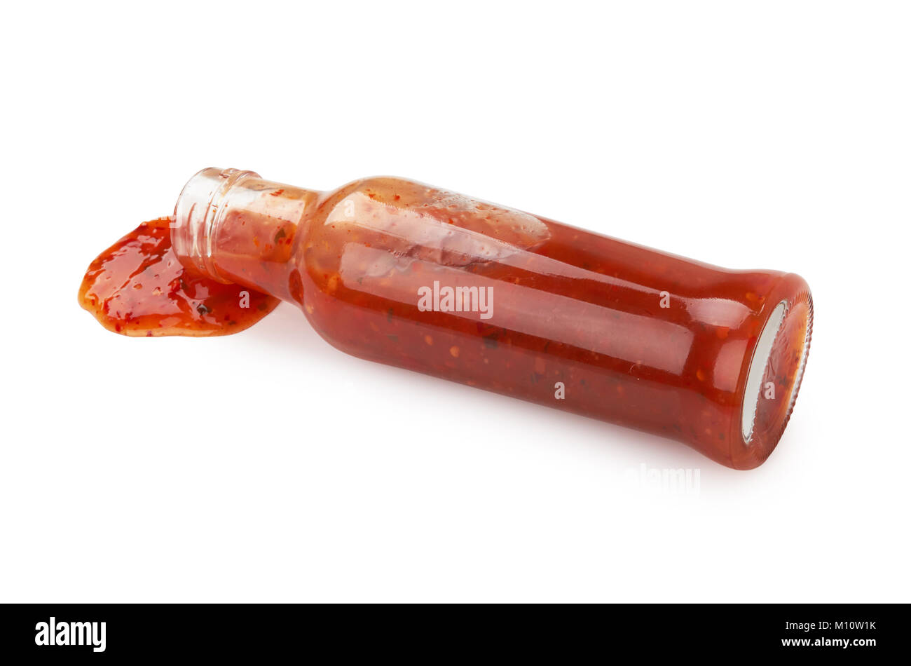 bottle of hot sauce is spilling liquid on white background Stock Photo ...