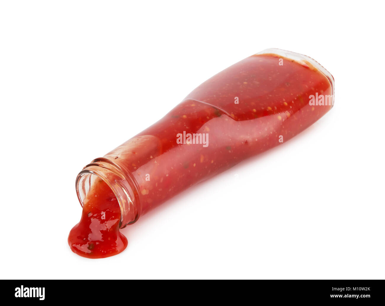 bottle of hot sauce is spilling liquid on white background Stock Photo ...