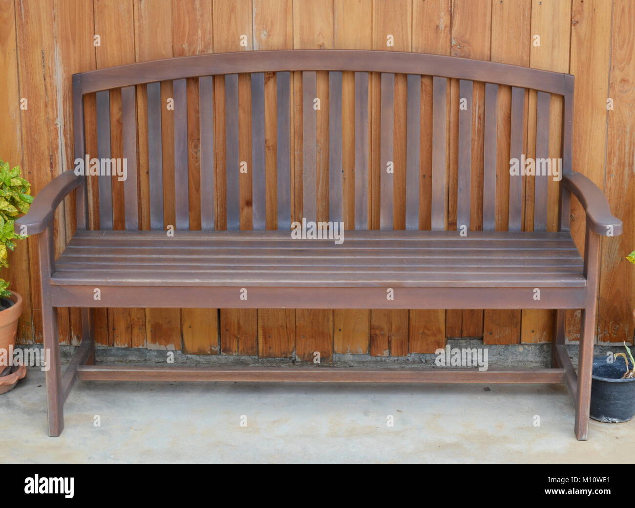 wooden bench on house wood wall Stock Photo - Alamy