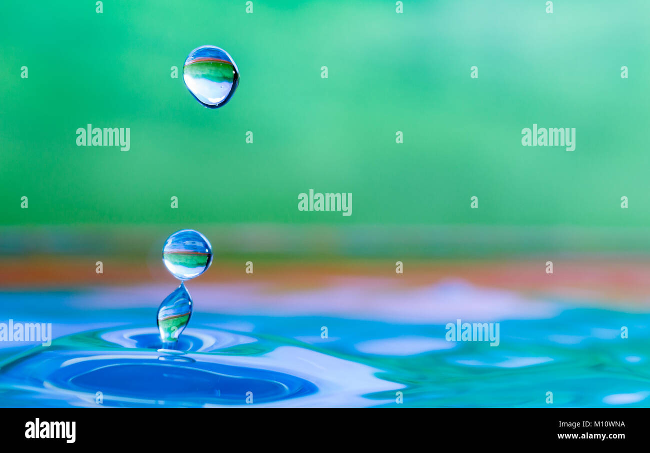 color photo of a water droplet splash front view Stock Photo - Alamy