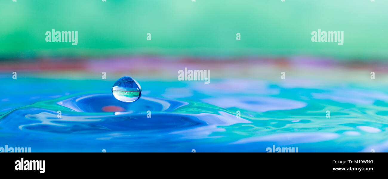 color photo of a water droplet splash front view Stock Photo - Alamy
