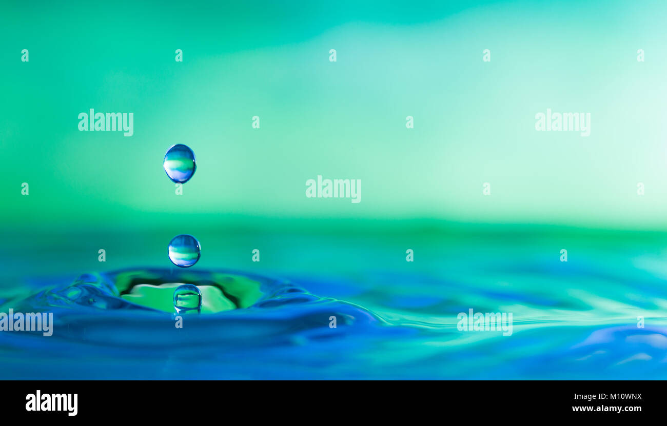 color photo of a water droplet splash front view Stock Photo - Alamy
