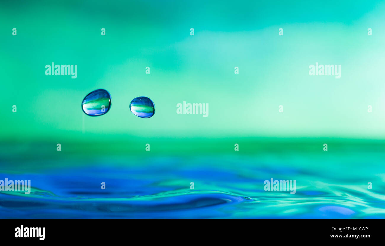 color photo of a water droplet splash front view Stock Photo - Alamy