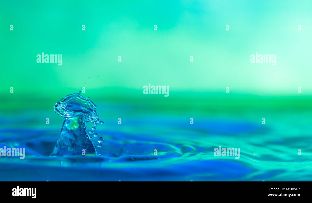 color photo of a water droplet splash front view Stock Photo - Alamy