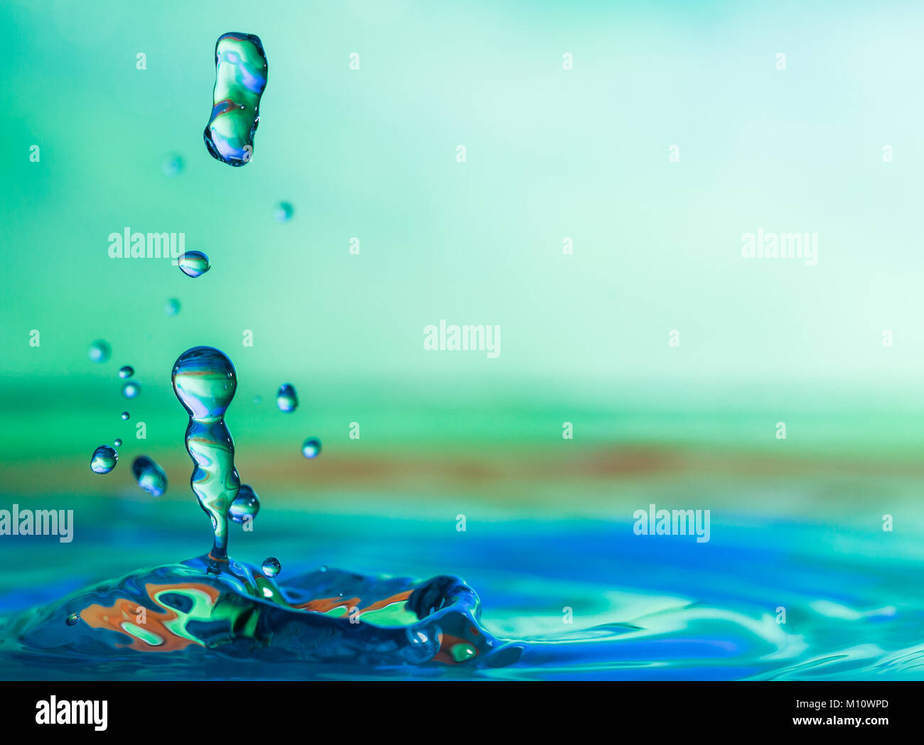 color photo of a water droplet splash front view Stock Photo - Alamy