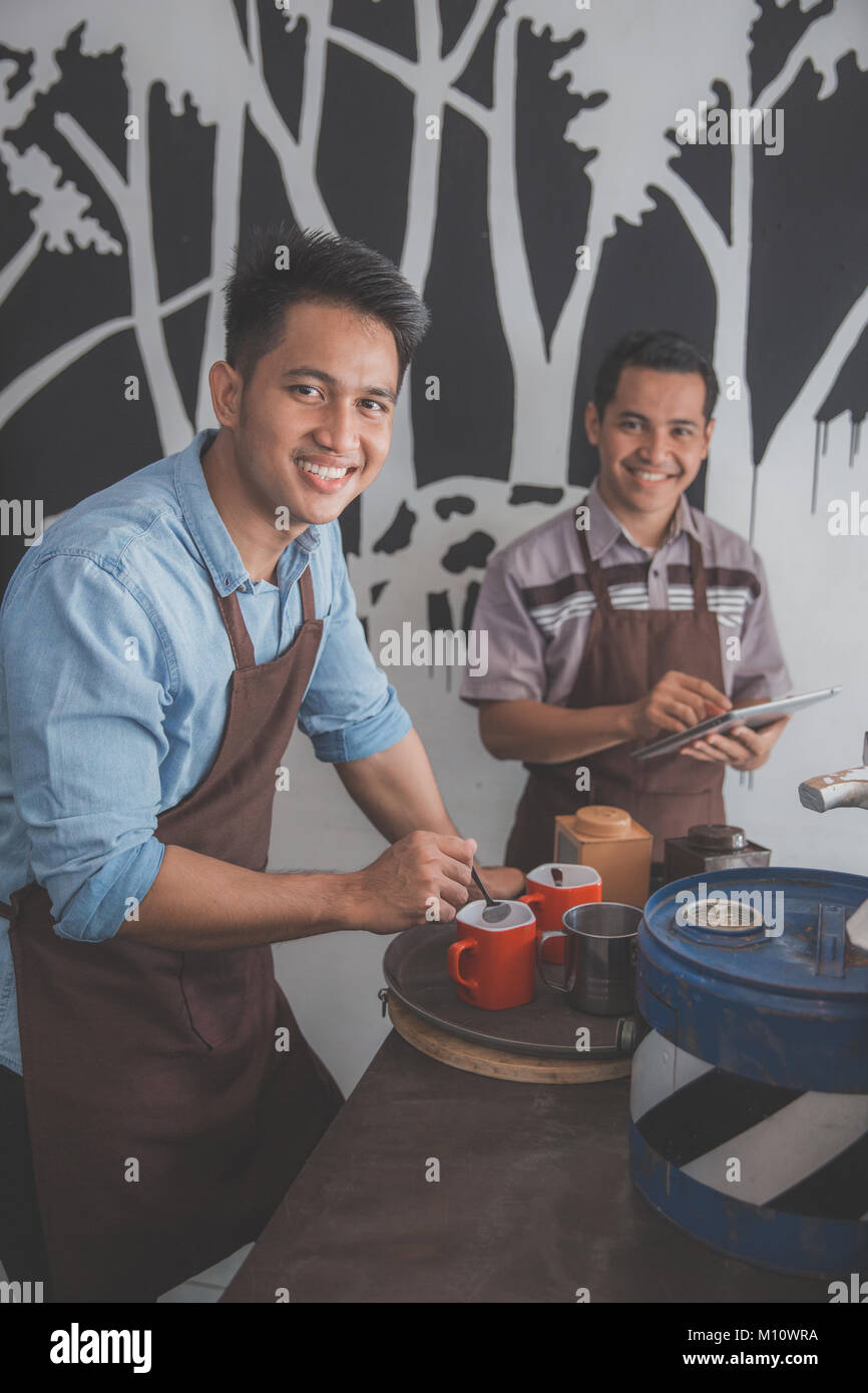 portrait of two male waiter preparing menu for customer Stock Photo - Alamy