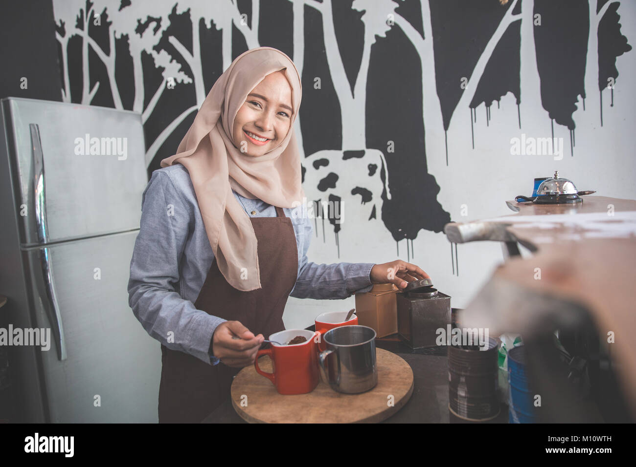 happy muslim asian worker preparing the menu at coffee shop Stock Photo ...