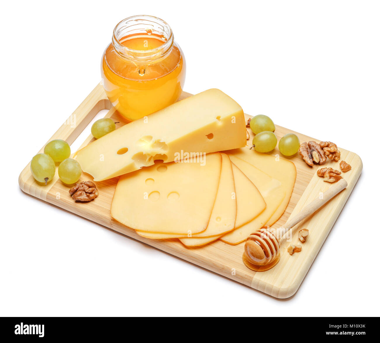 swiss cheese or cheddar and honey on white background Stock Photo - Alamy