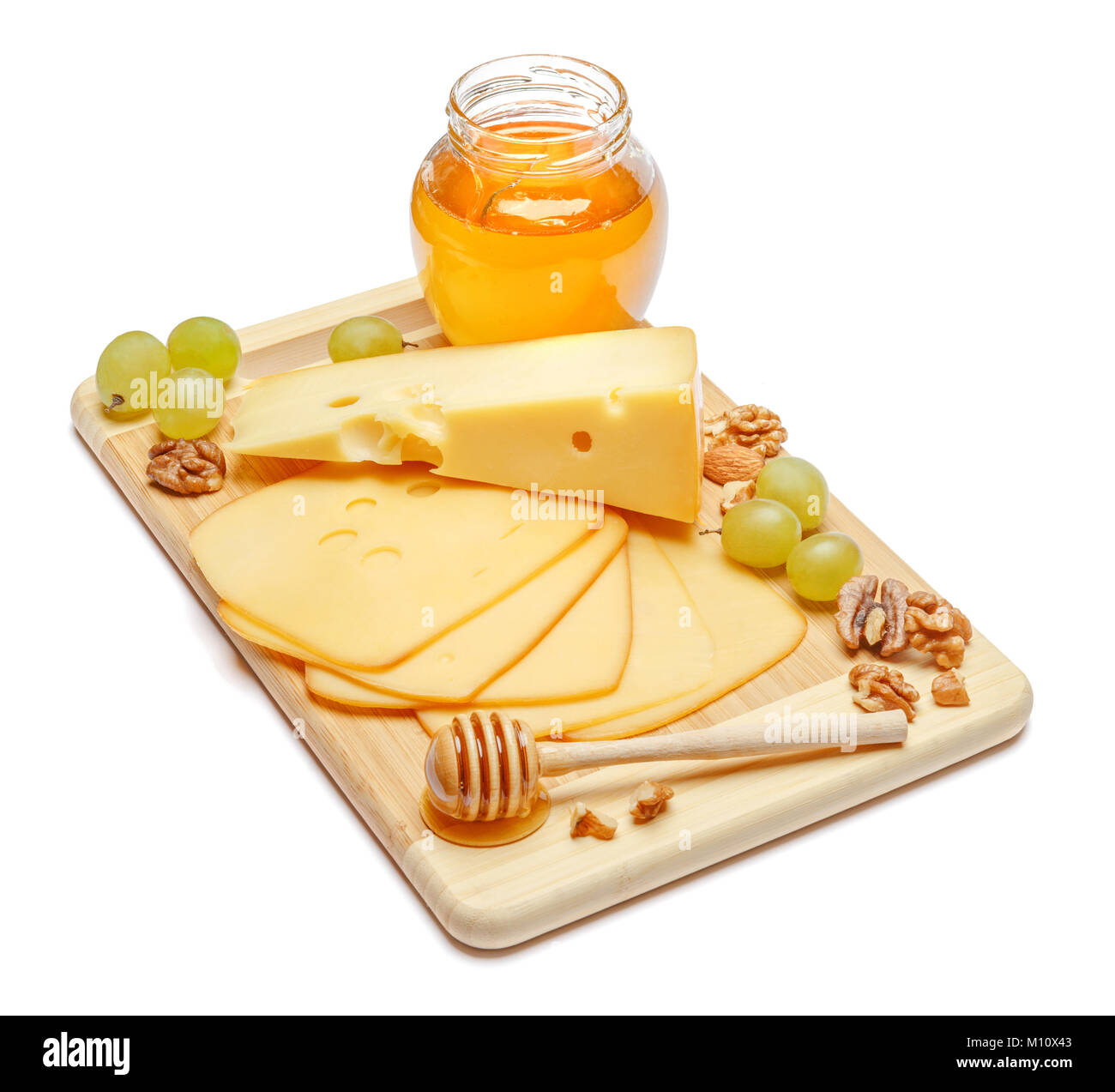 swiss cheese or cheddar and honey on white background Stock Photo - Alamy