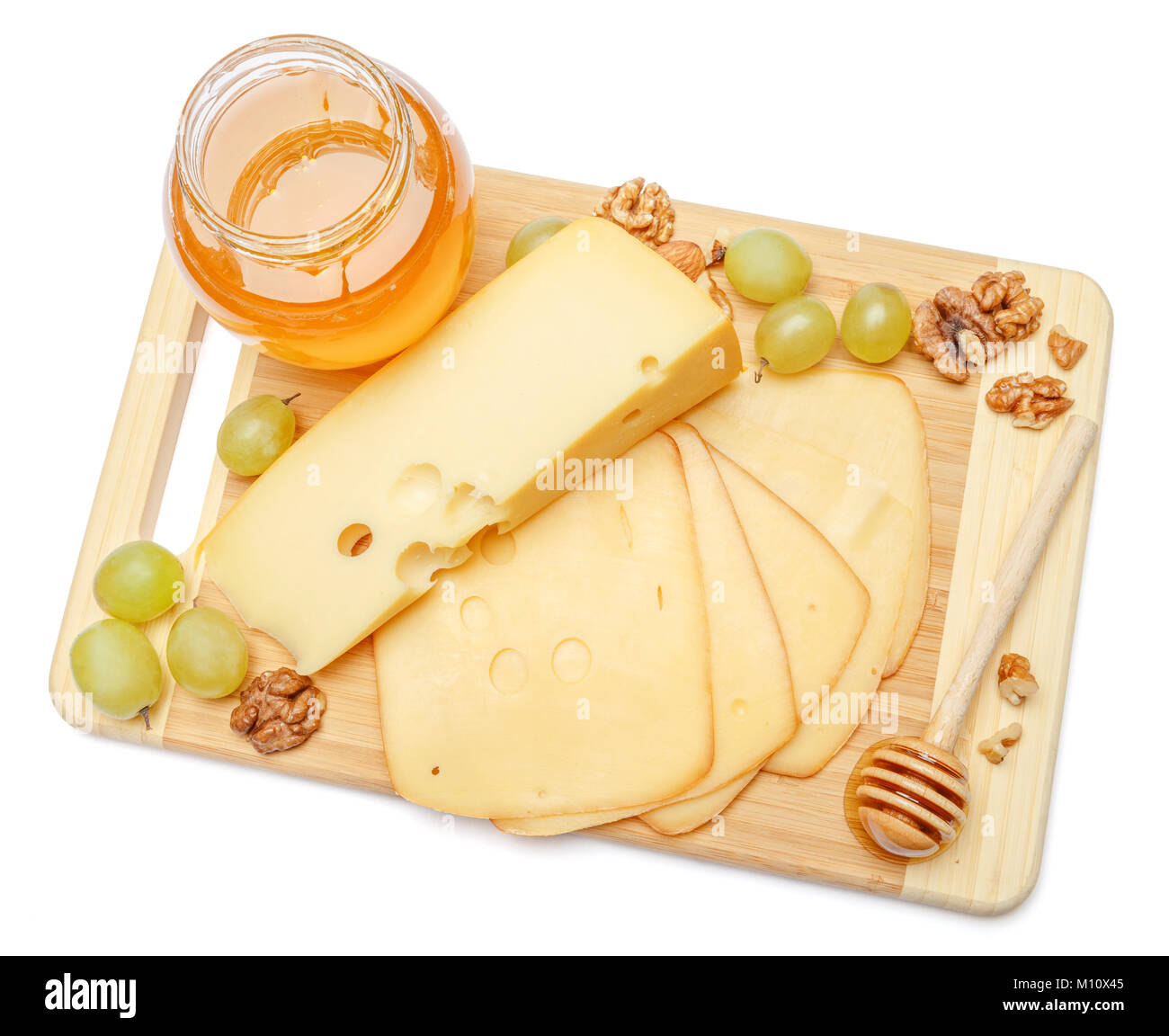 swiss cheese or cheddar and honey on white background Stock Photo - Alamy