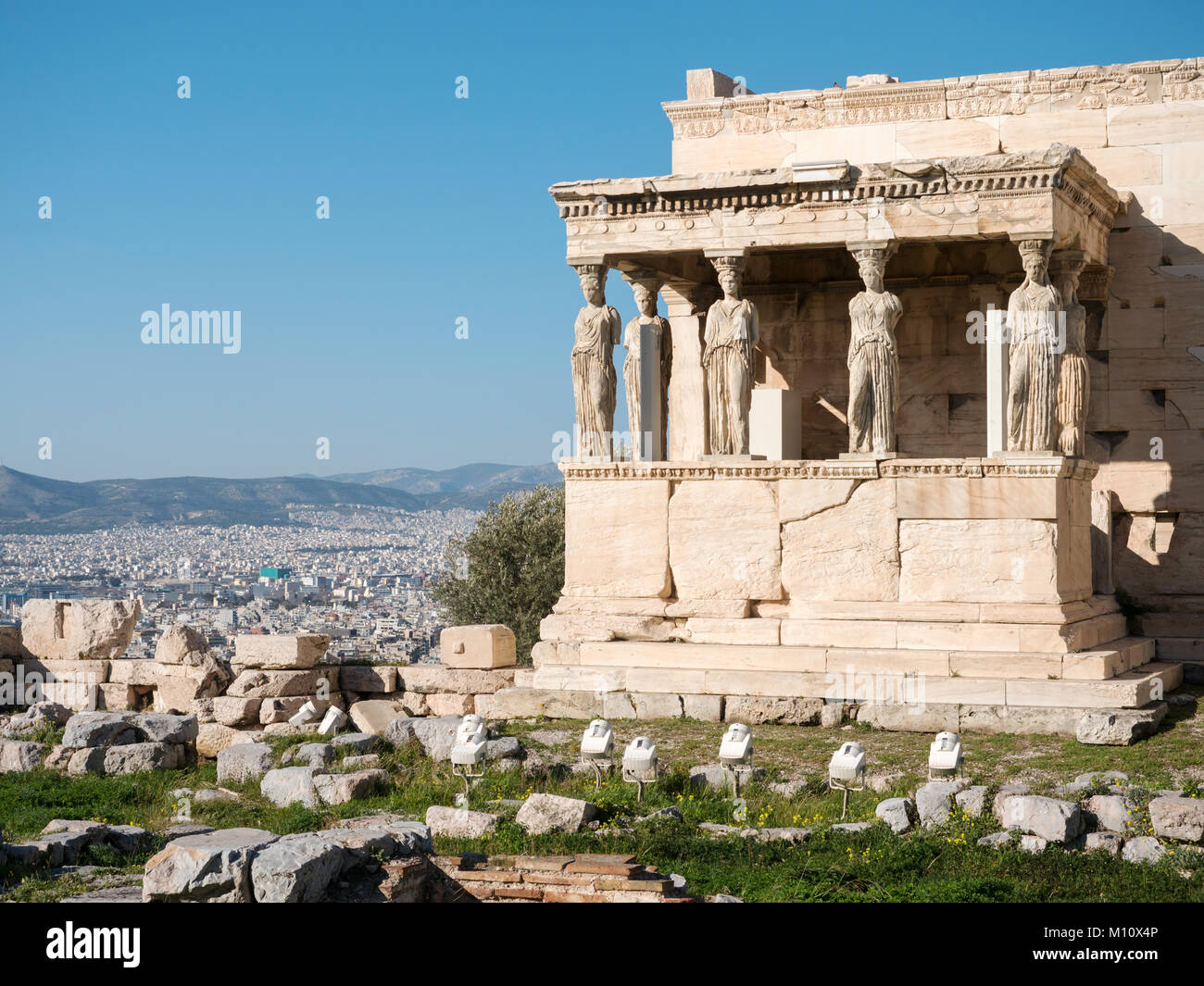 The Erechtheum with caryatids near Parthenon temple in Acropolis hill ...