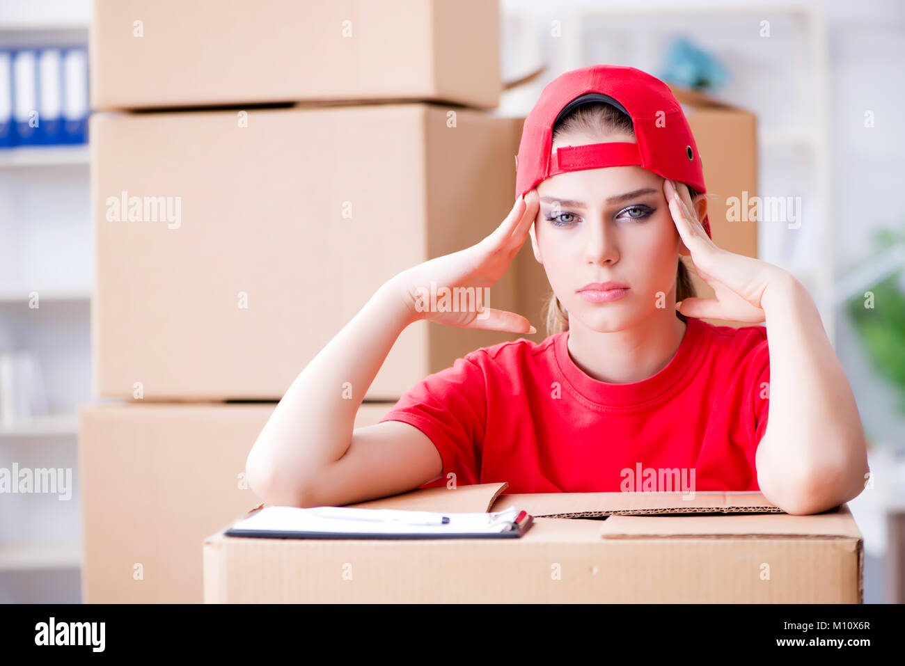 Young woman delivering boxes of personal effects Stock Photo - Alamy