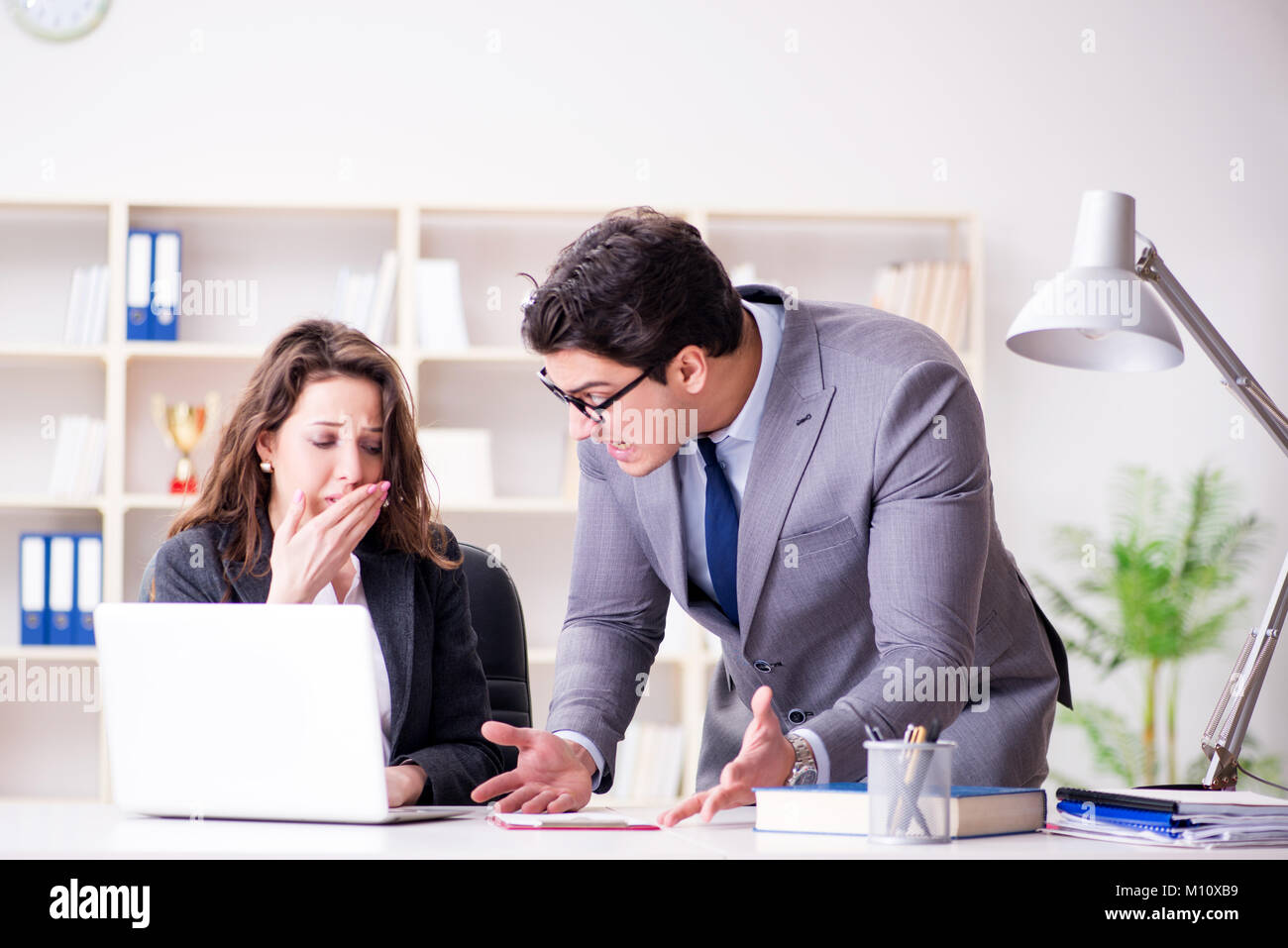 Angry boss unhappy with female employee performance Stock Photo - Alamy