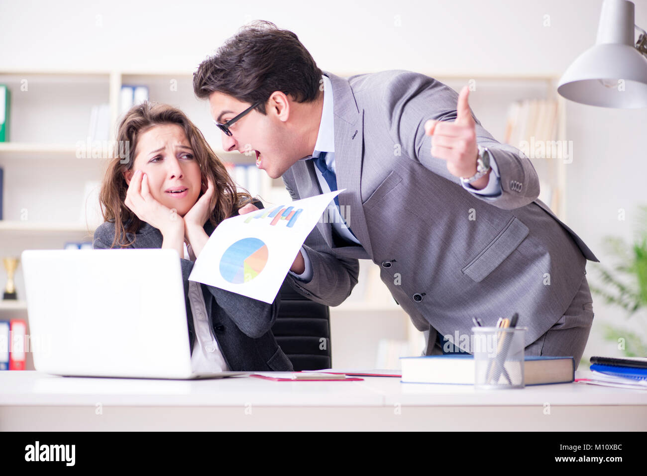 Angry boss unhappy with female employee performance Stock Photo - Alamy