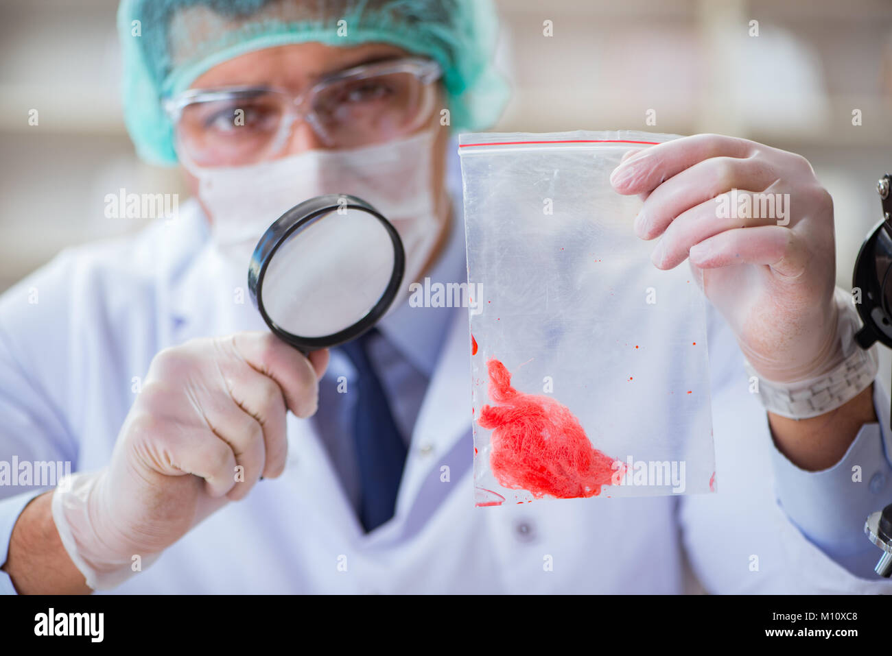 Forensics investigator working in lab on crime evidence Stock Photo - Alamy