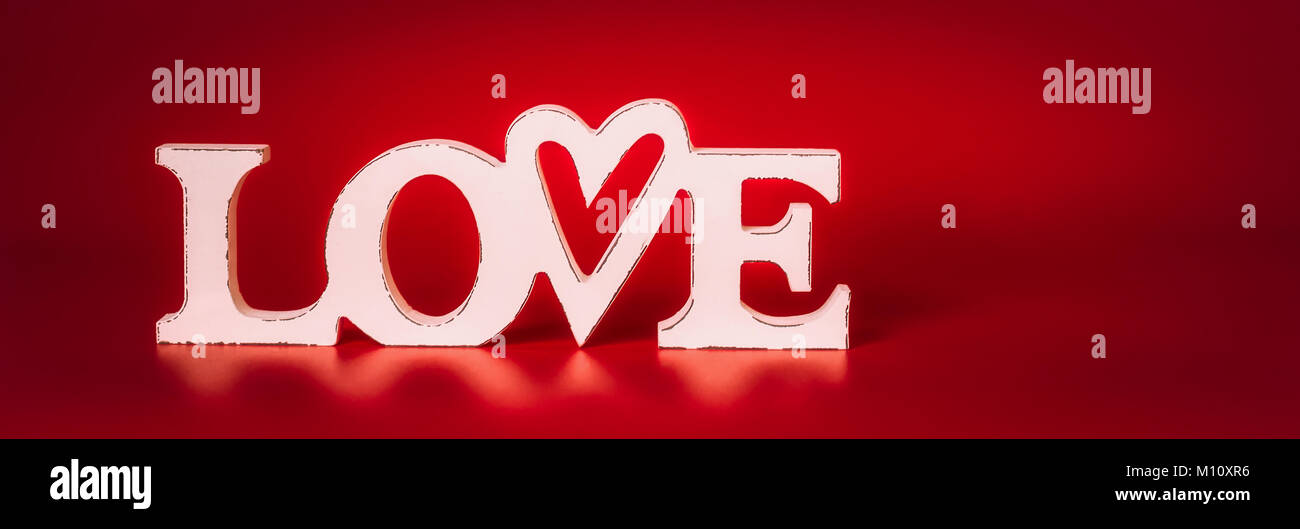 White Word Love on red background, front view. Valentines day concept ...