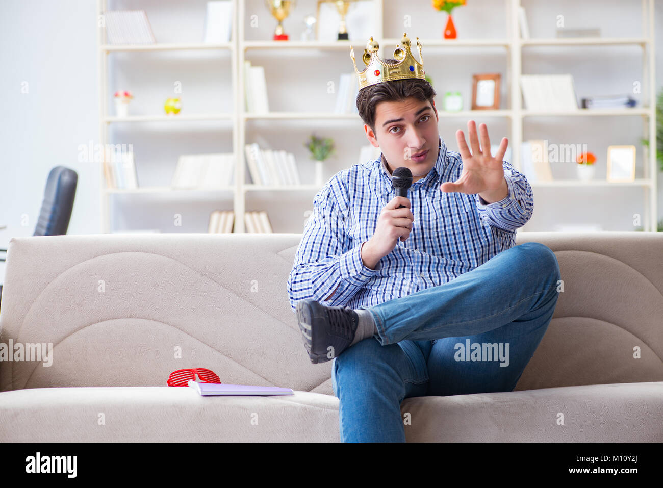 Funny man singing songs in karaoke at home Stock Photo - Alamy