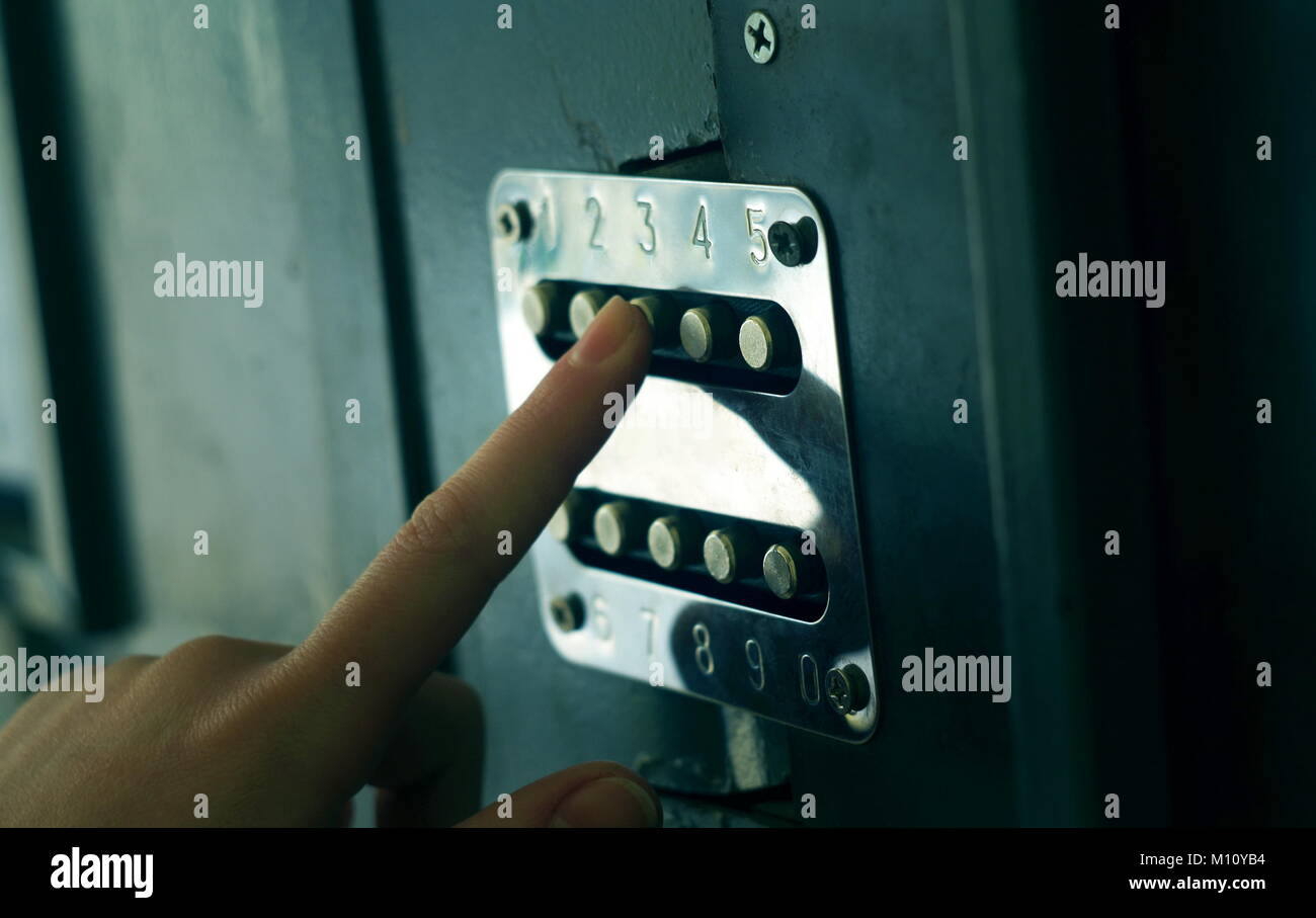 Applying security code on the door Stock Photo - Alamy