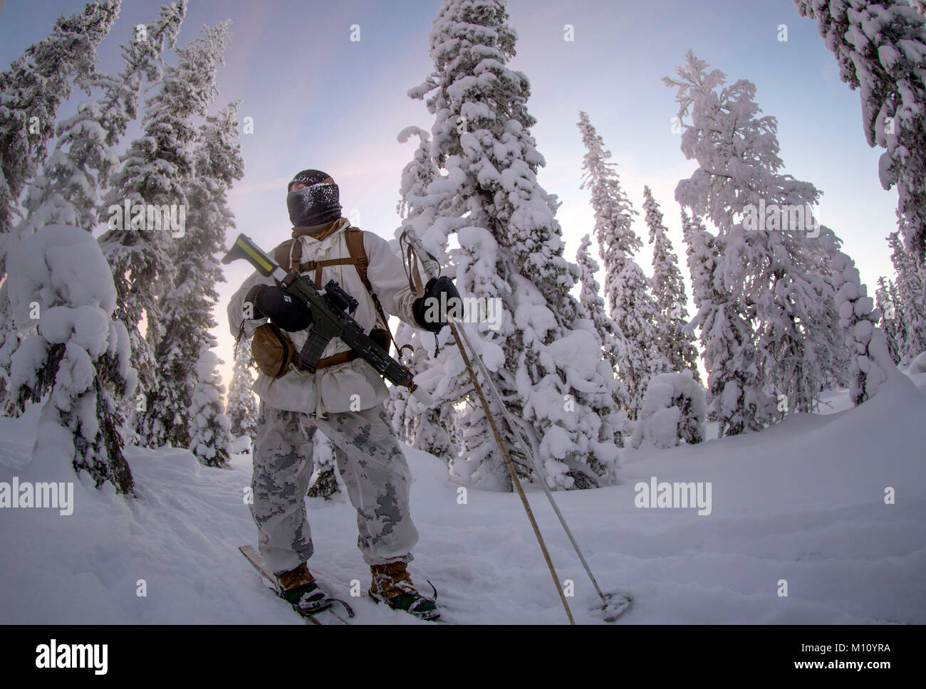 Marine participating in the Swedish Basic Winter Warfare Course rests ...