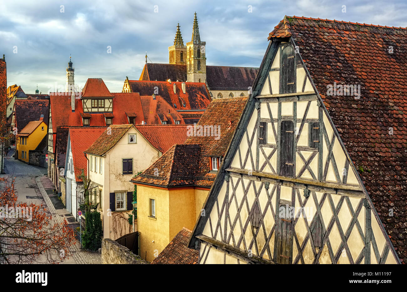 Traditional gothic style half-timbered houses with red tiled roofs in ...