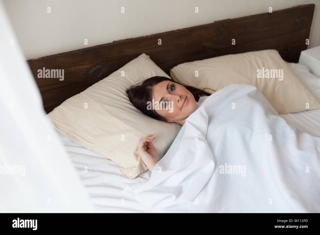 girl wakes up in the morning in the bedroom Stock Photo - Alamy