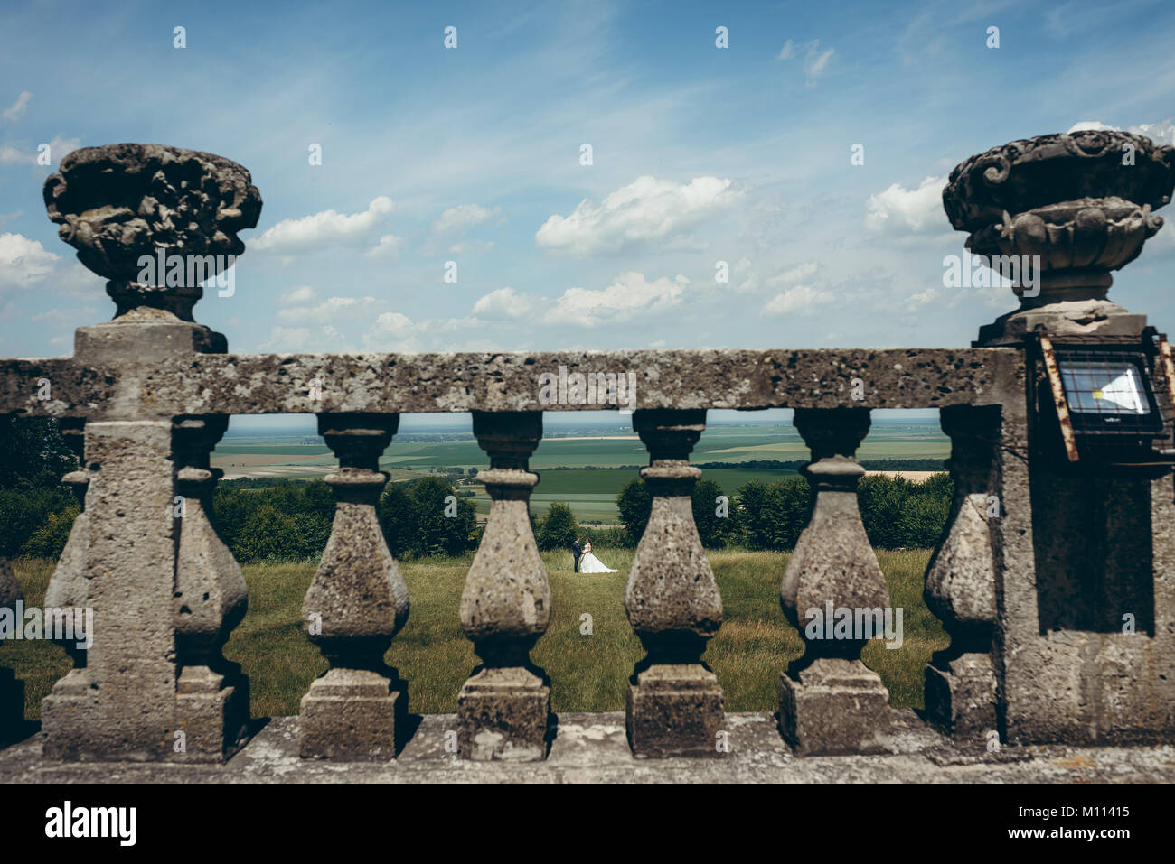 Close-up view of the old stone fence. The view through the fence on the ...