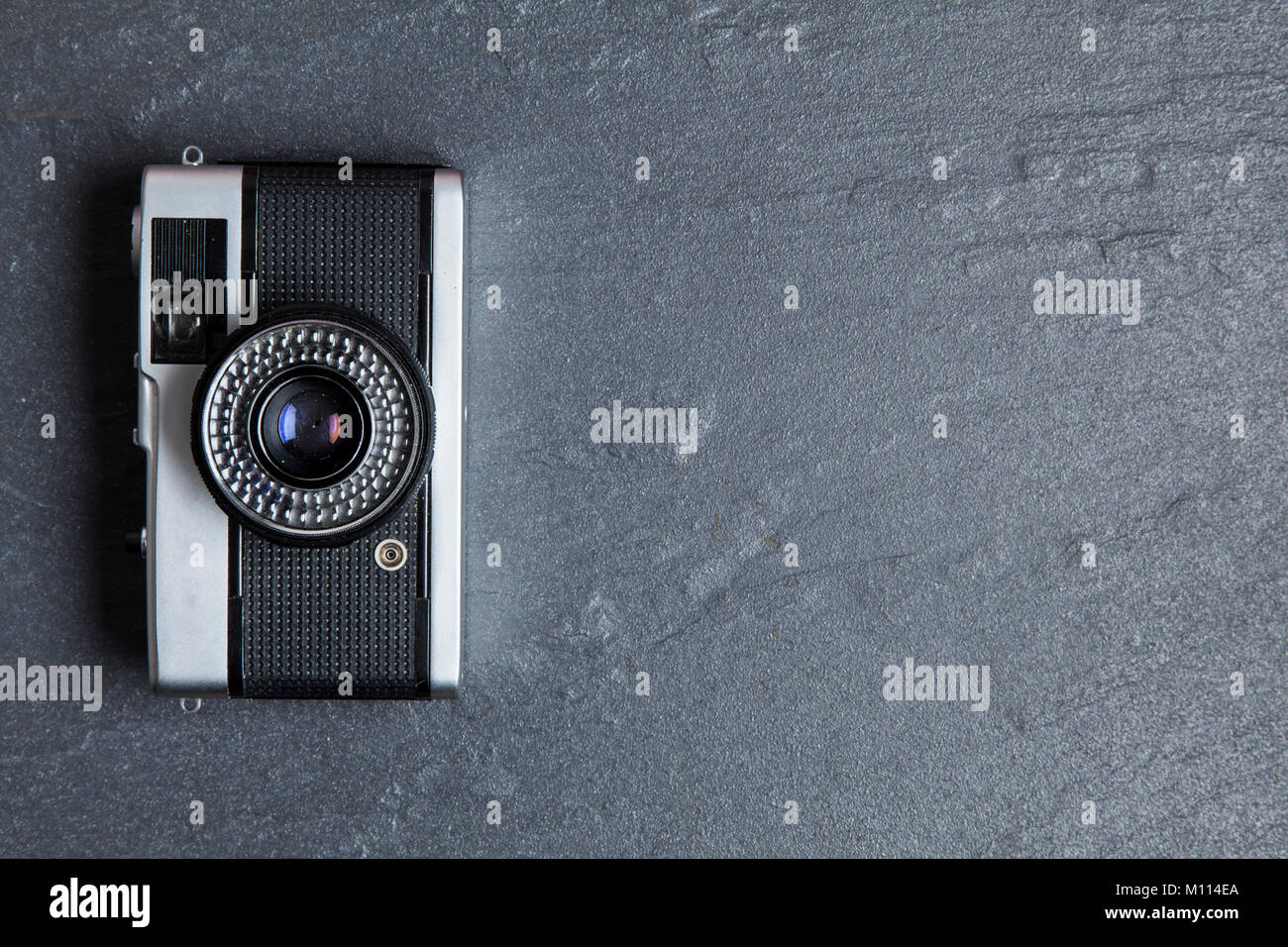 Vintage film camera on a slate background Stock Photo - Alamy