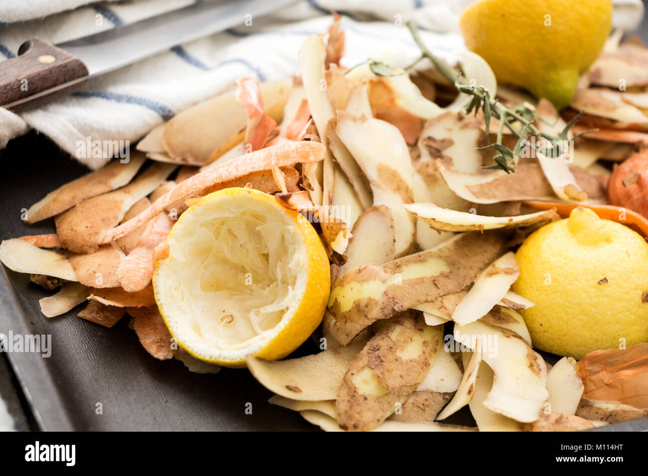 Fresh vegetable peels with knife and towel Stock Photo - Alamy