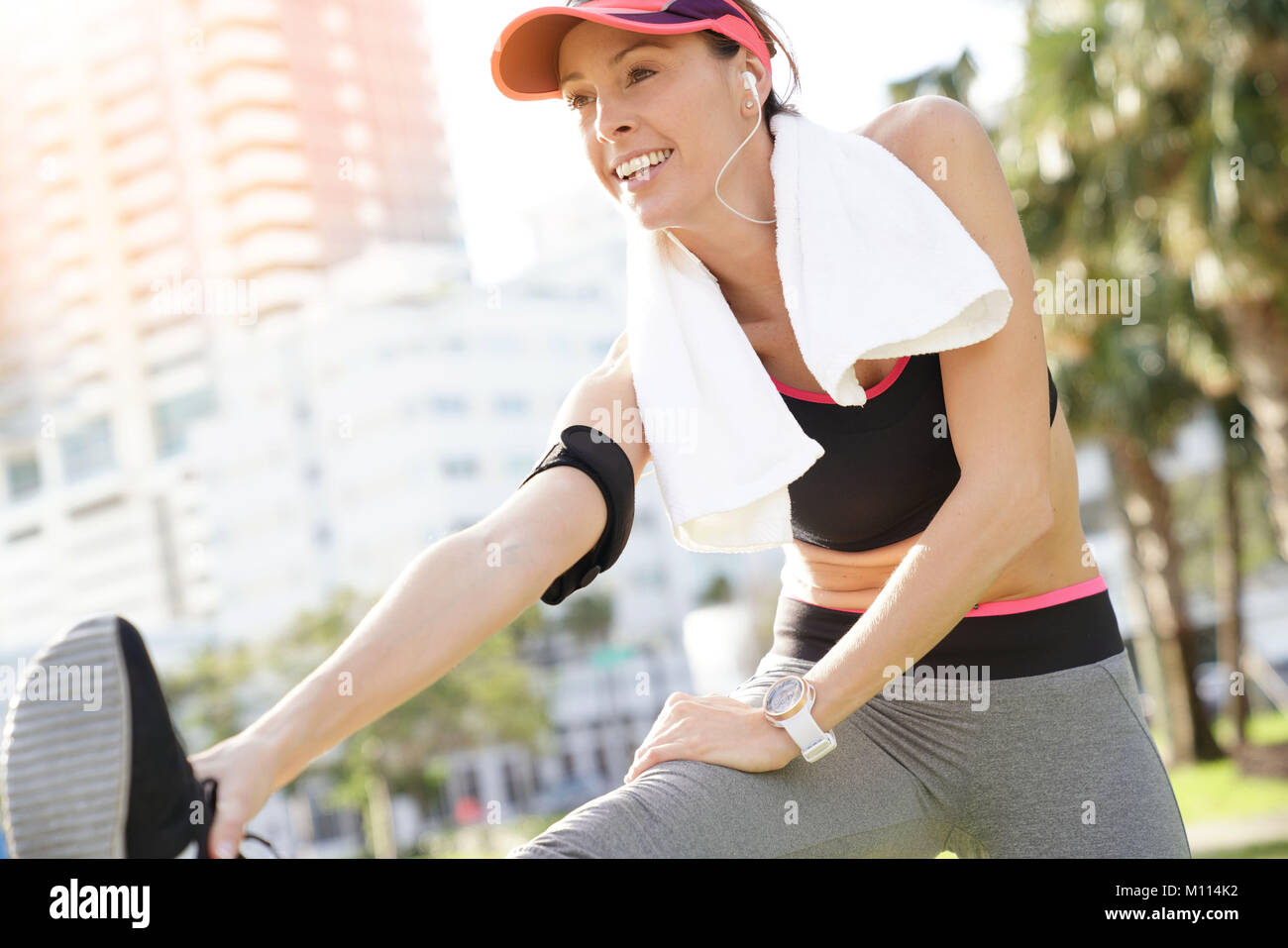 Fitness girl stretching after exercising Stock Photo - Alamy