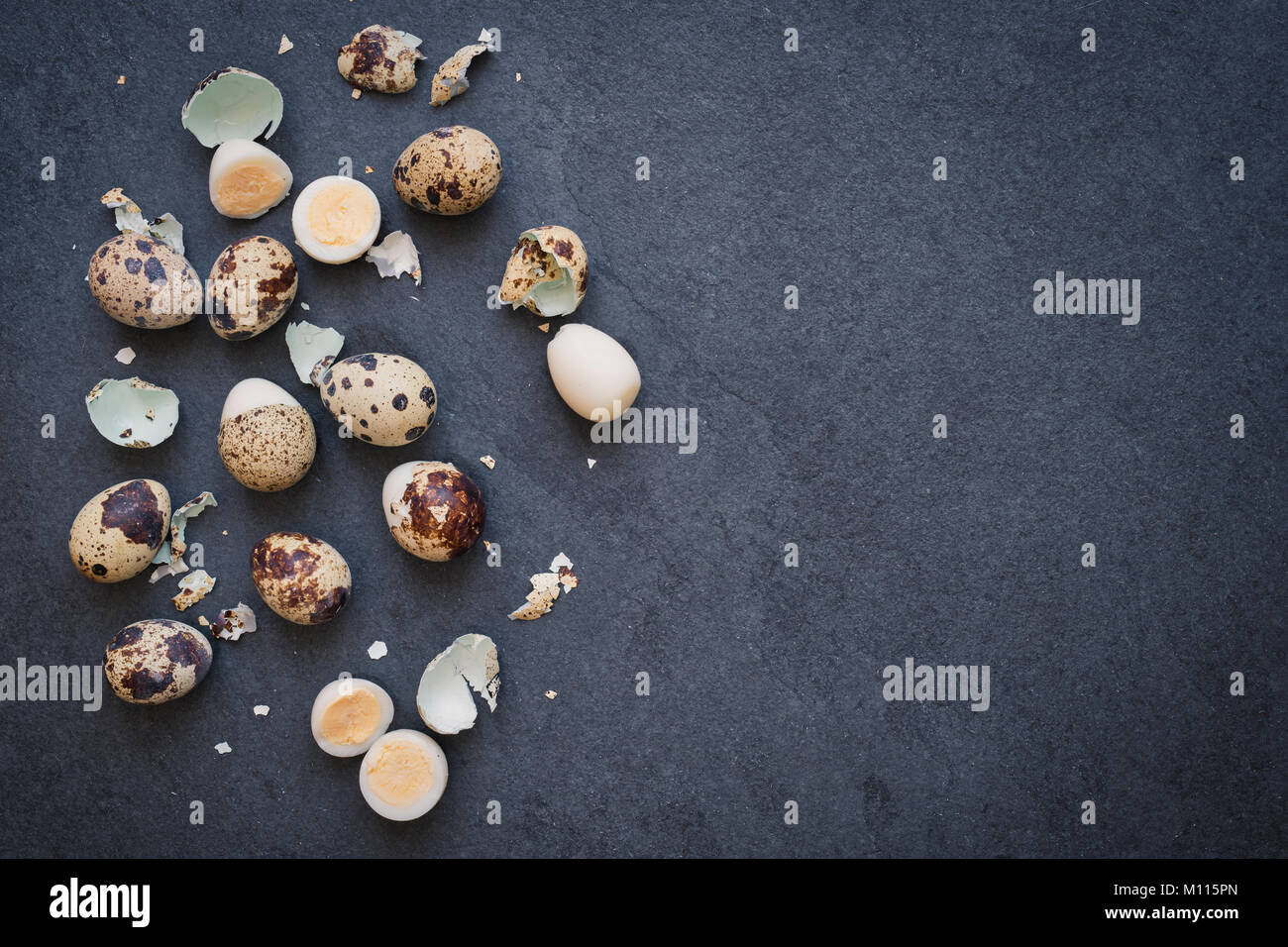 Hard boiled Quail Eggs and shells on a slate background Stock Photo - Alamy
