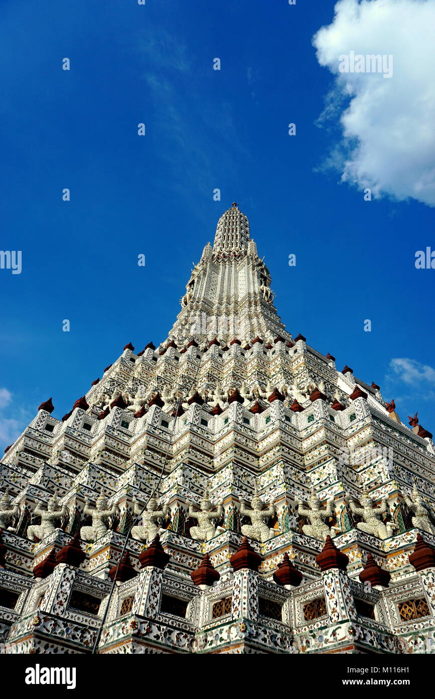 The temple of Wat Arun and its' colorful and detailed structures with a ...