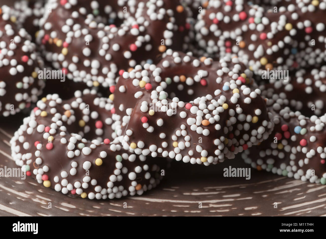 Cake rings with icing and topping, close up shot Stock Photo - Alamy