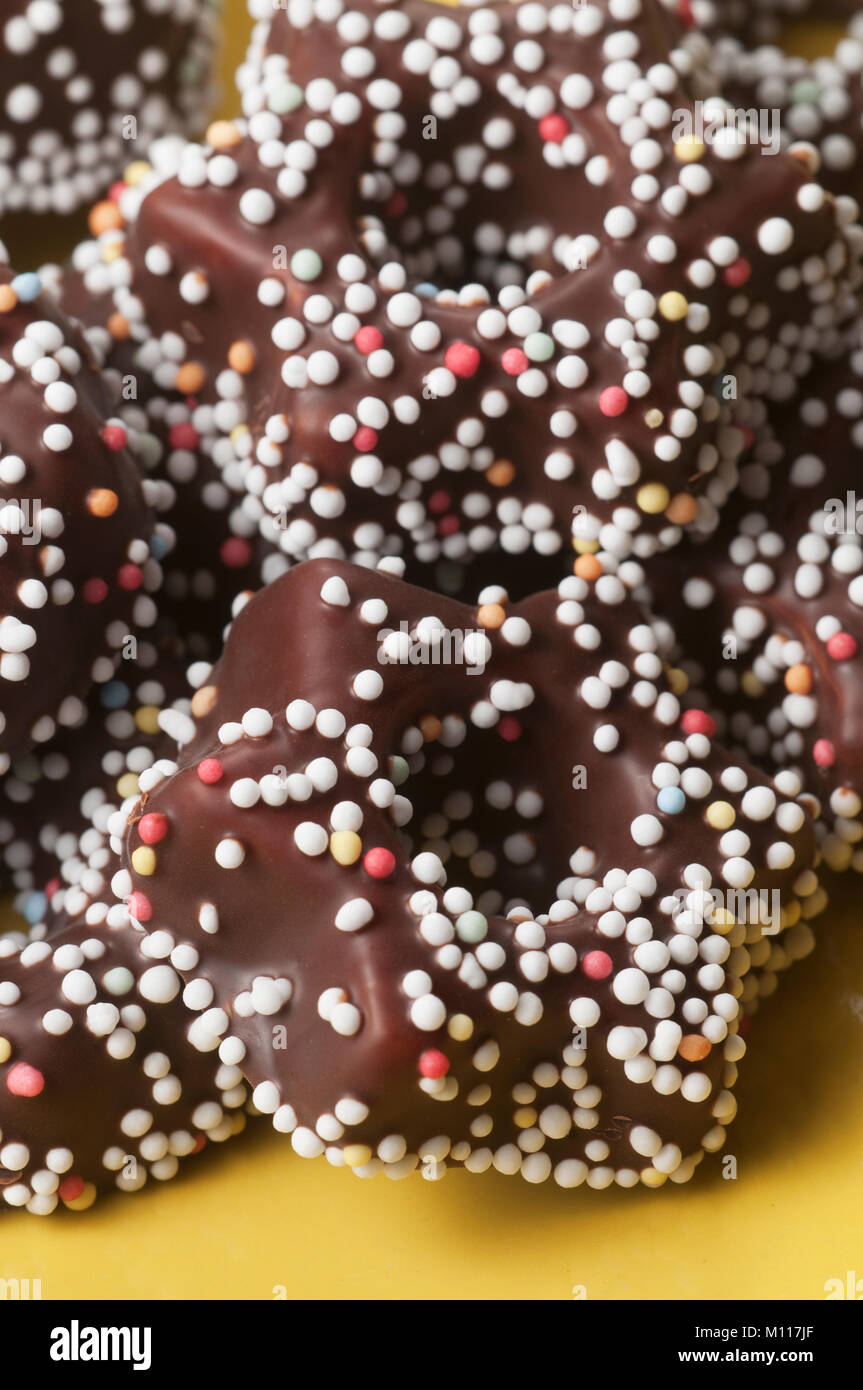 Cake rings with icing and topping, close up shot Stock Photo - Alamy