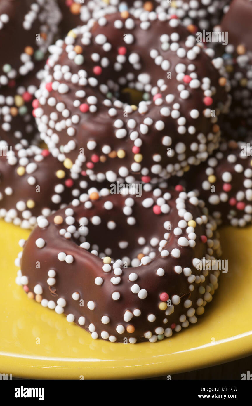 Cake rings with icing and topping, close up shot Stock Photo - Alamy