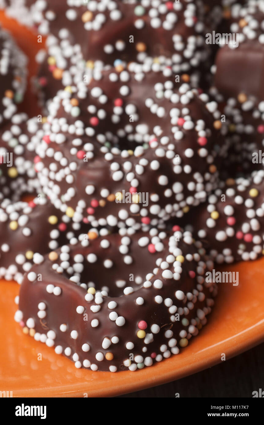 Cake rings with icing and topping, close up shot Stock Photo - Alamy