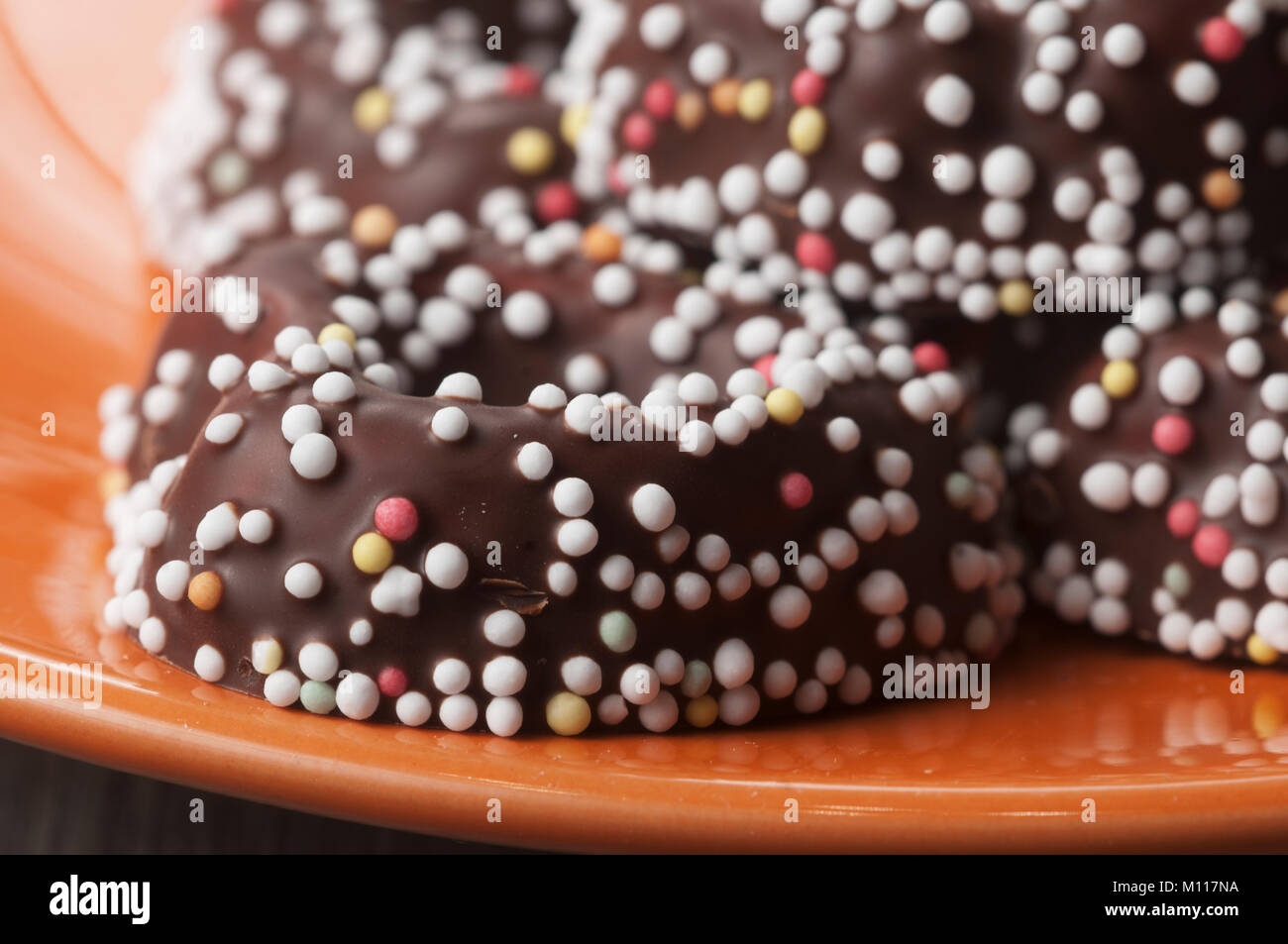 Cake rings with icing and topping, close up shot Stock Photo - Alamy