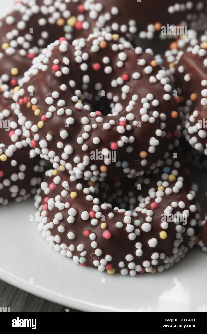 Cake rings with icing and topping, close up shot Stock Photo - Alamy