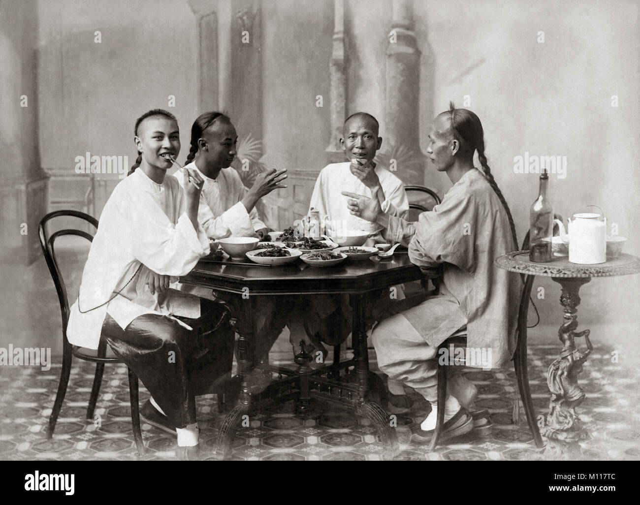 Chinese men eating a meal, c.1890's, China Stock Photo - Alamy
