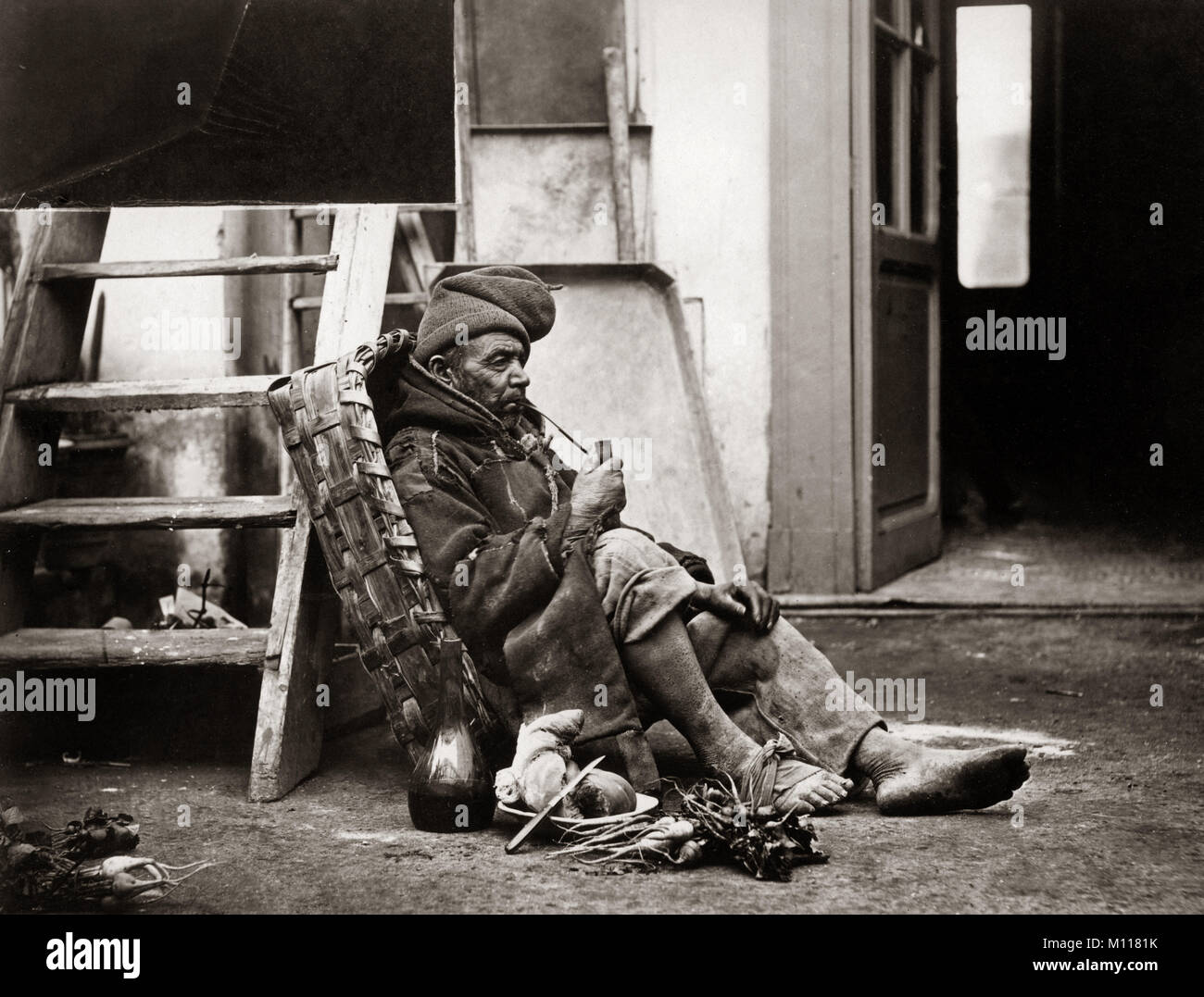 Old fisherman with his pipe and a basket of vegetables, Naples, Italy ...