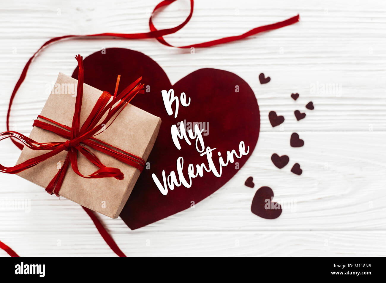 be my valentine text sign. stylish present box and hearts flat lay on ...