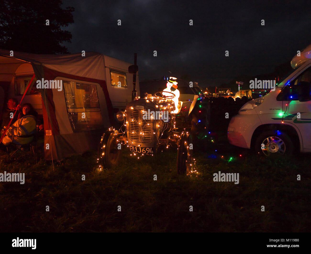 Snowman and tractor at Ashover festival of lights Stock Photo - Alamy