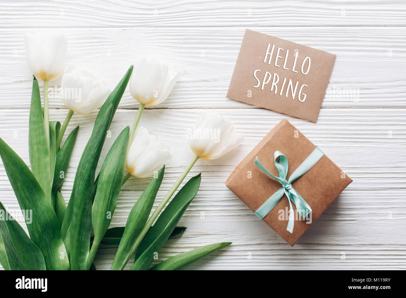 hello spring text sign on stylish craft present box and greeting card ...