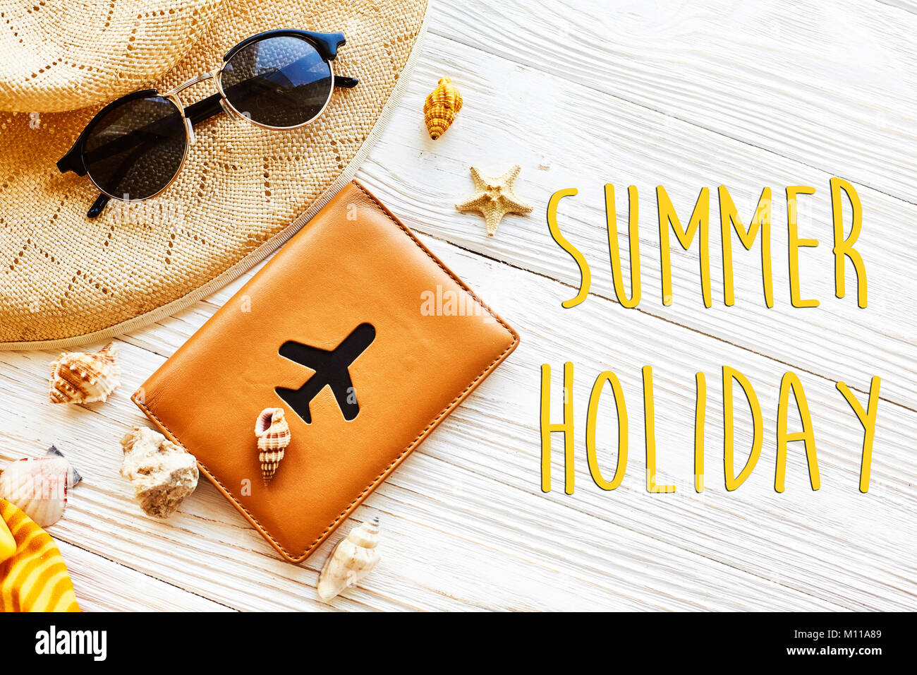 summer holiday text, vacation concept flat lay. yellow hat, sunglasses ...