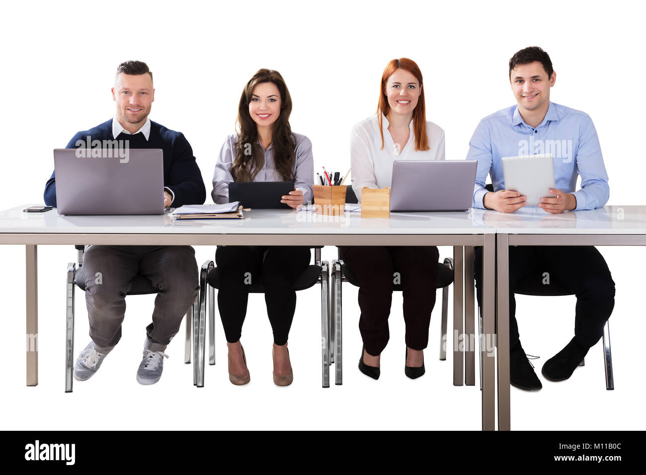 Portrait Of Confident Business People Sitting At Table For Taking ...