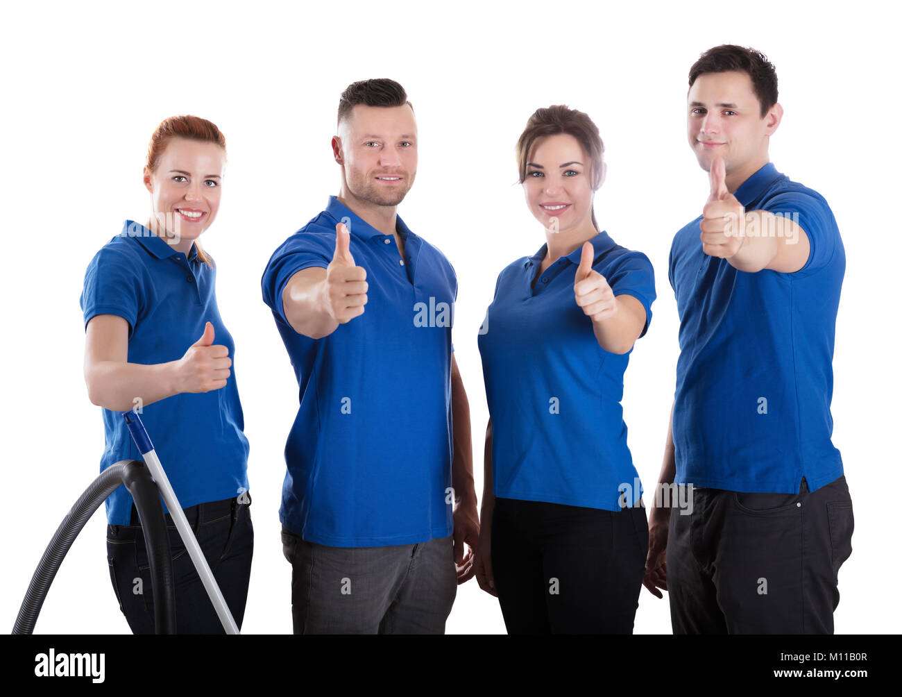 Portrait Of Happy Janitors Showing Thumb Up Sign Against White ...