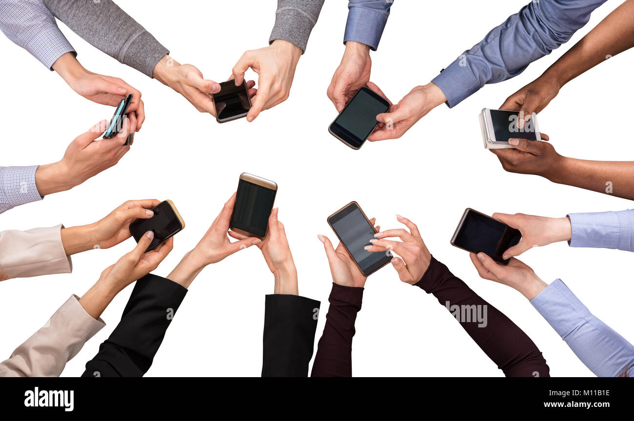 Elevated View Of Hands Using Cell Phone Against White Background Stock ...