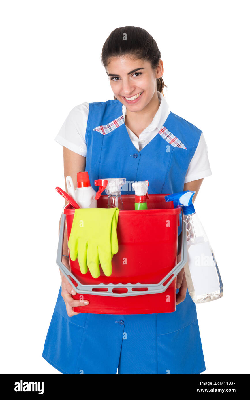 Young Happy Female Janitor With Cleaning Equipments Against White ...