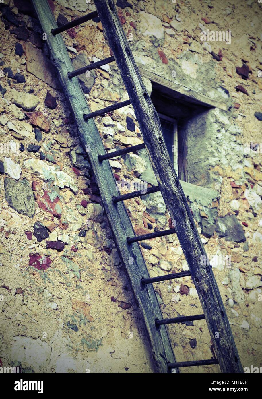 Ancient long wooden ladder near the old house in the farm Stock Photo ...