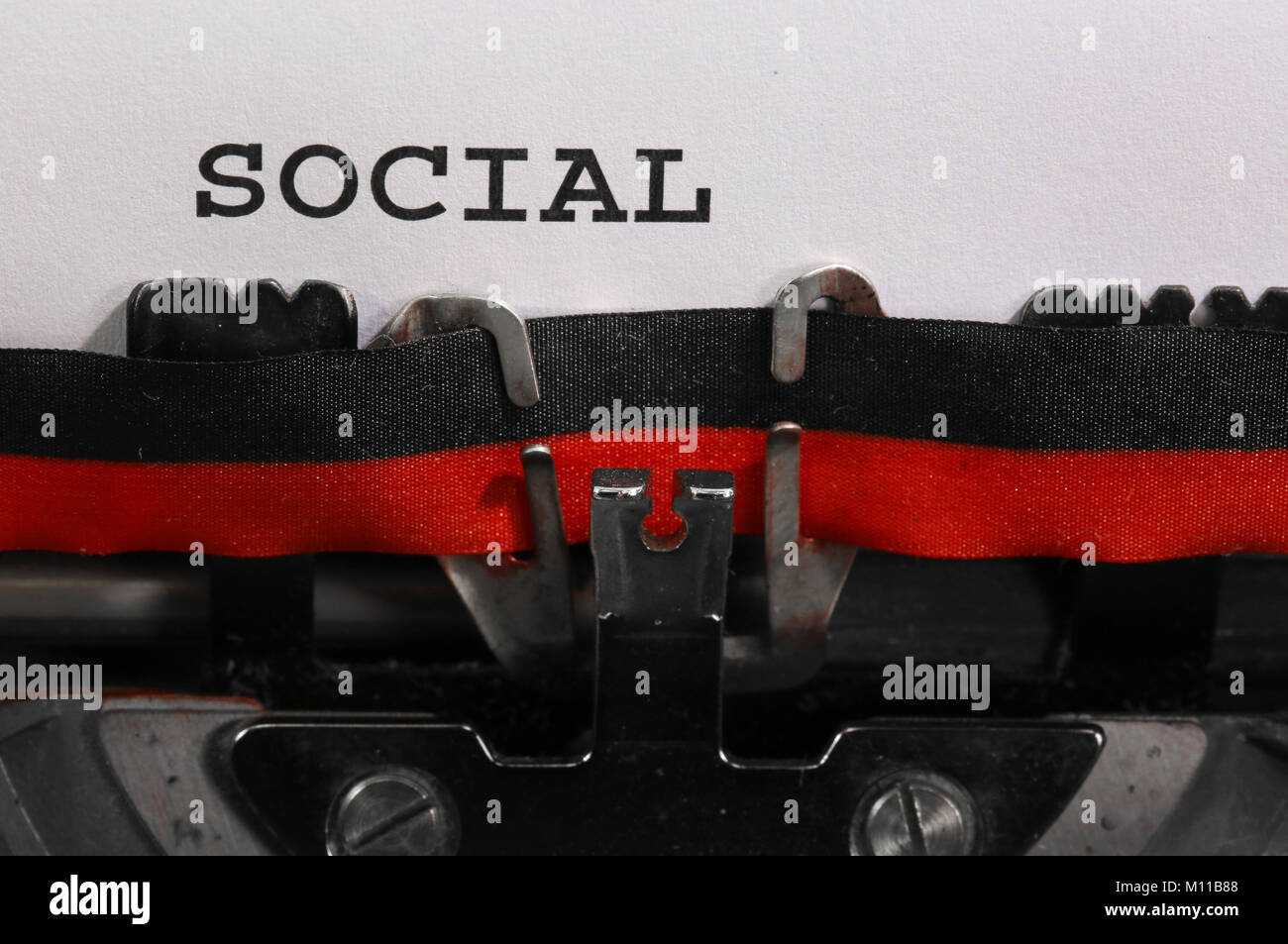 Word SOCIAL written with the old typewriter on white sheet Stock Photo ...